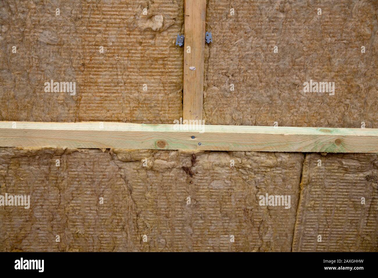 warming the walls of a stone house with a stone wool heater. Ecological ...