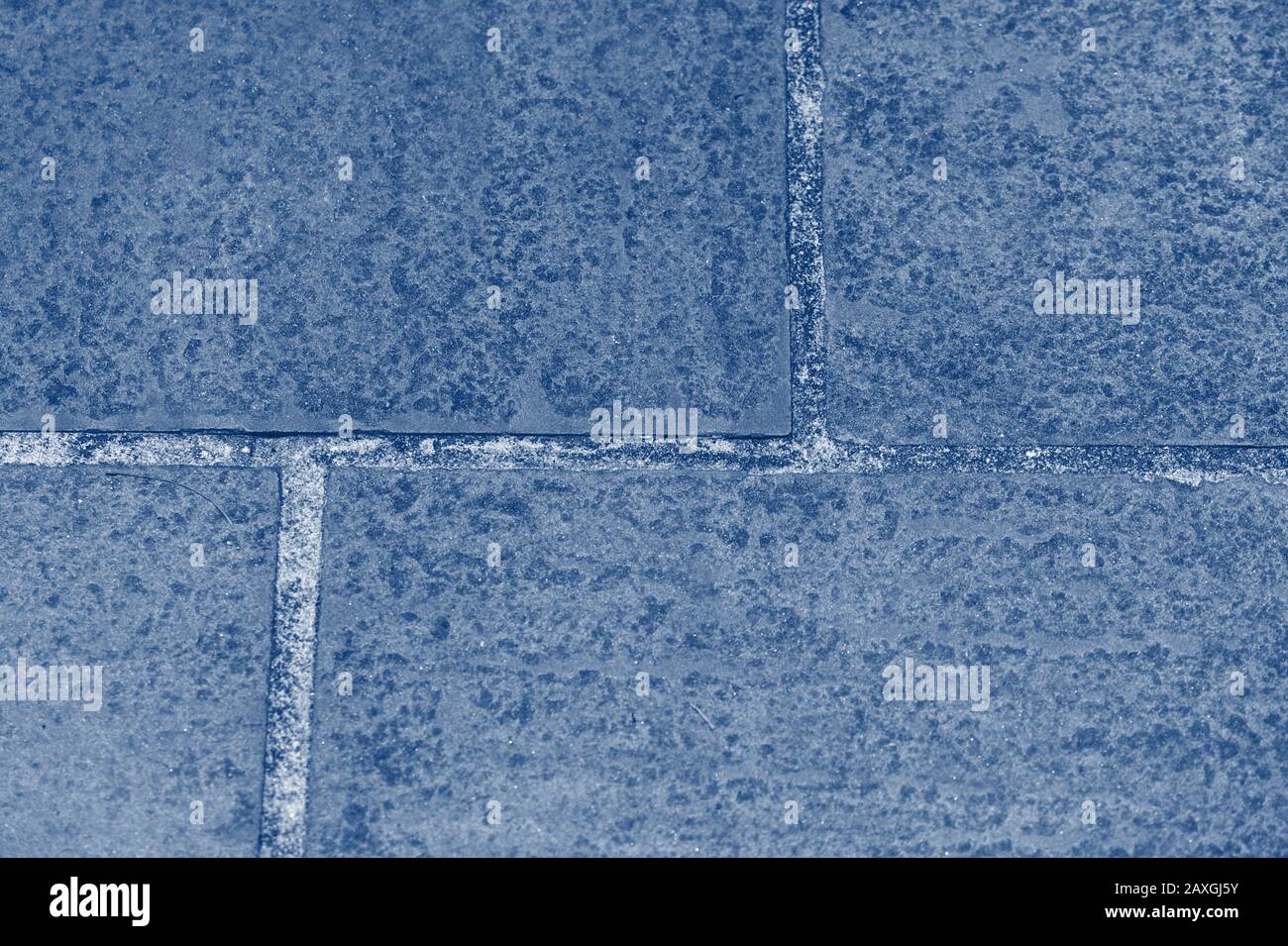 Paving slabs close-up, top view. Abstract background blue color toned ...