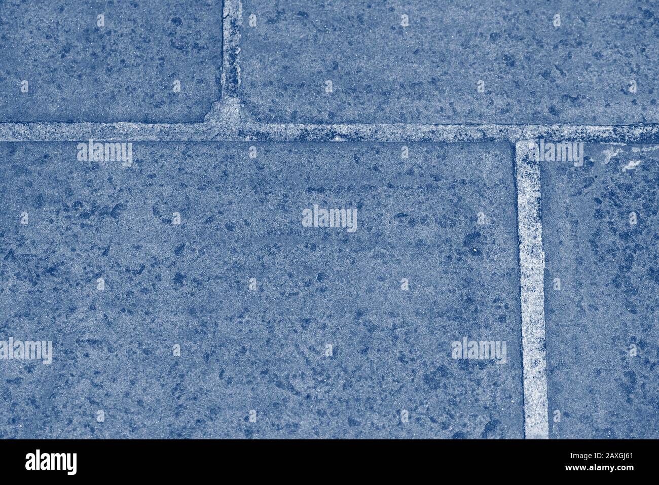 Paving slabs close-up, top view. Abstract background blue color toned ...