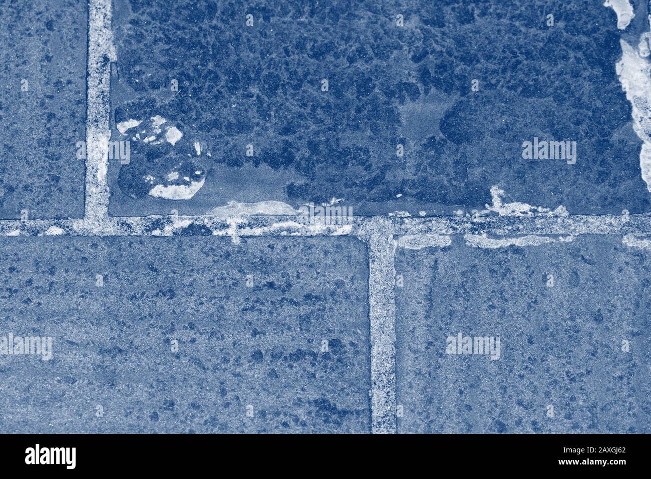 Paving slabs close-up, top view. Abstract background blue color toned ...