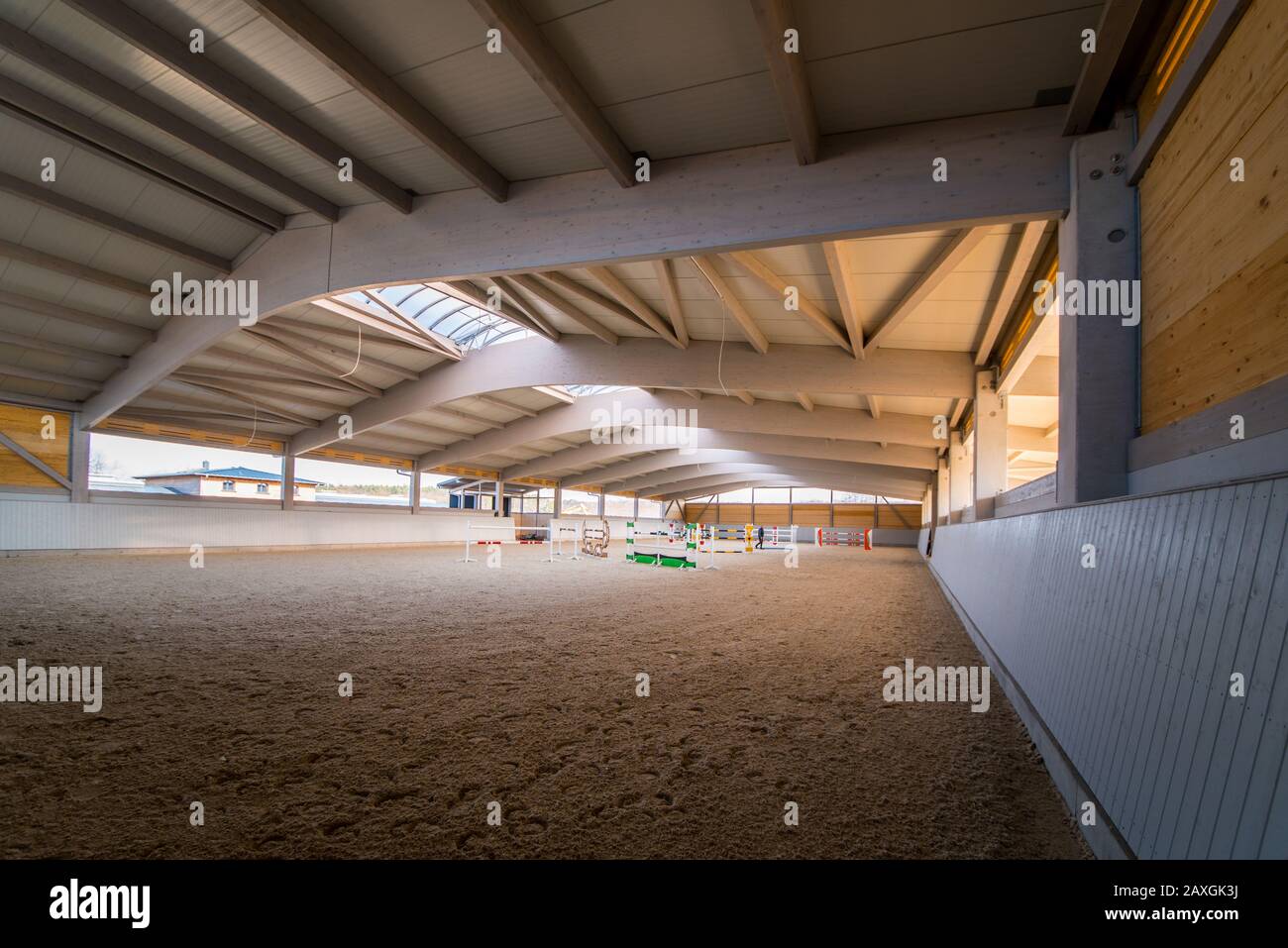 an elaborate roof construction covers a newly built giant riding arena ...