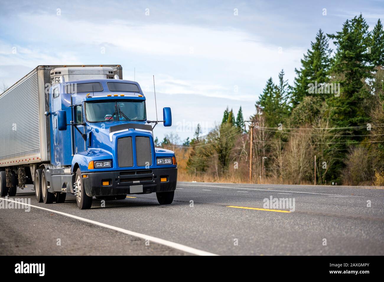 Big rig blue classic powerful diesel long haul semi truck transporting ...