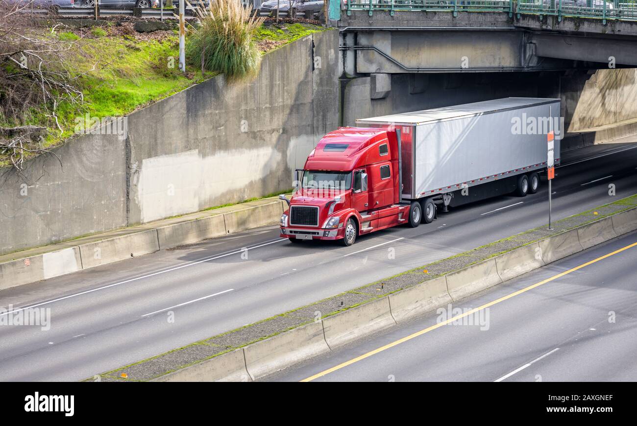 Big rig long haul red semi truck with high cab for improve aerodynamics ...