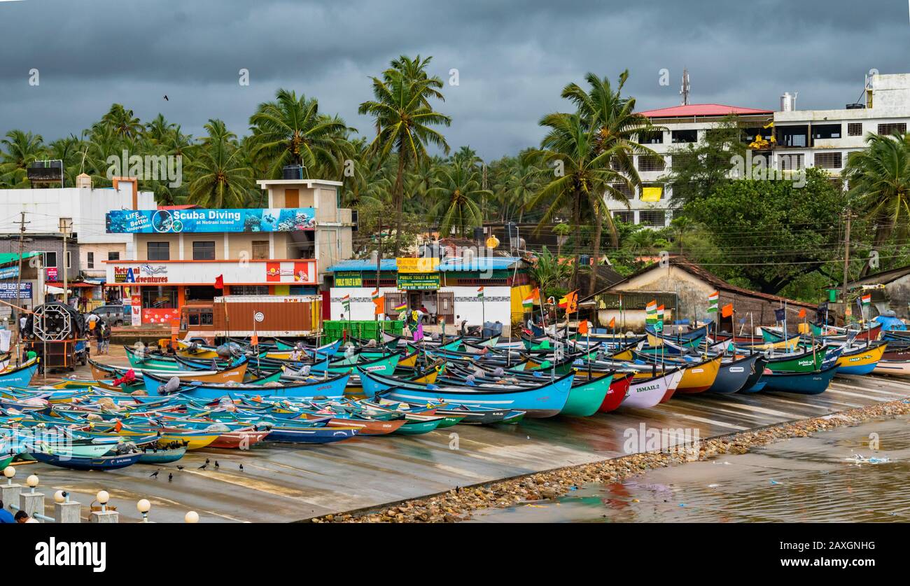 Beautiful coastal beach village of India, where Colorful fishing canoes ...