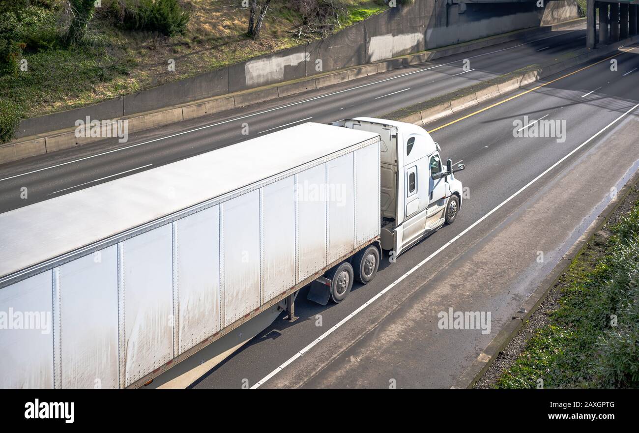 Big rig long haul white semi truck with high cab configuration for ...