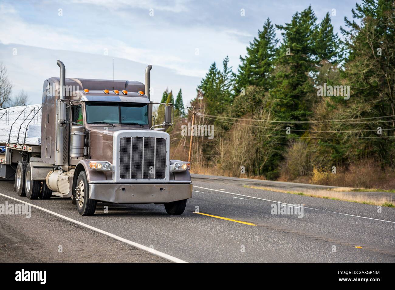 Powerful classic big rig long haul brown diesel semi truck with chrome ...