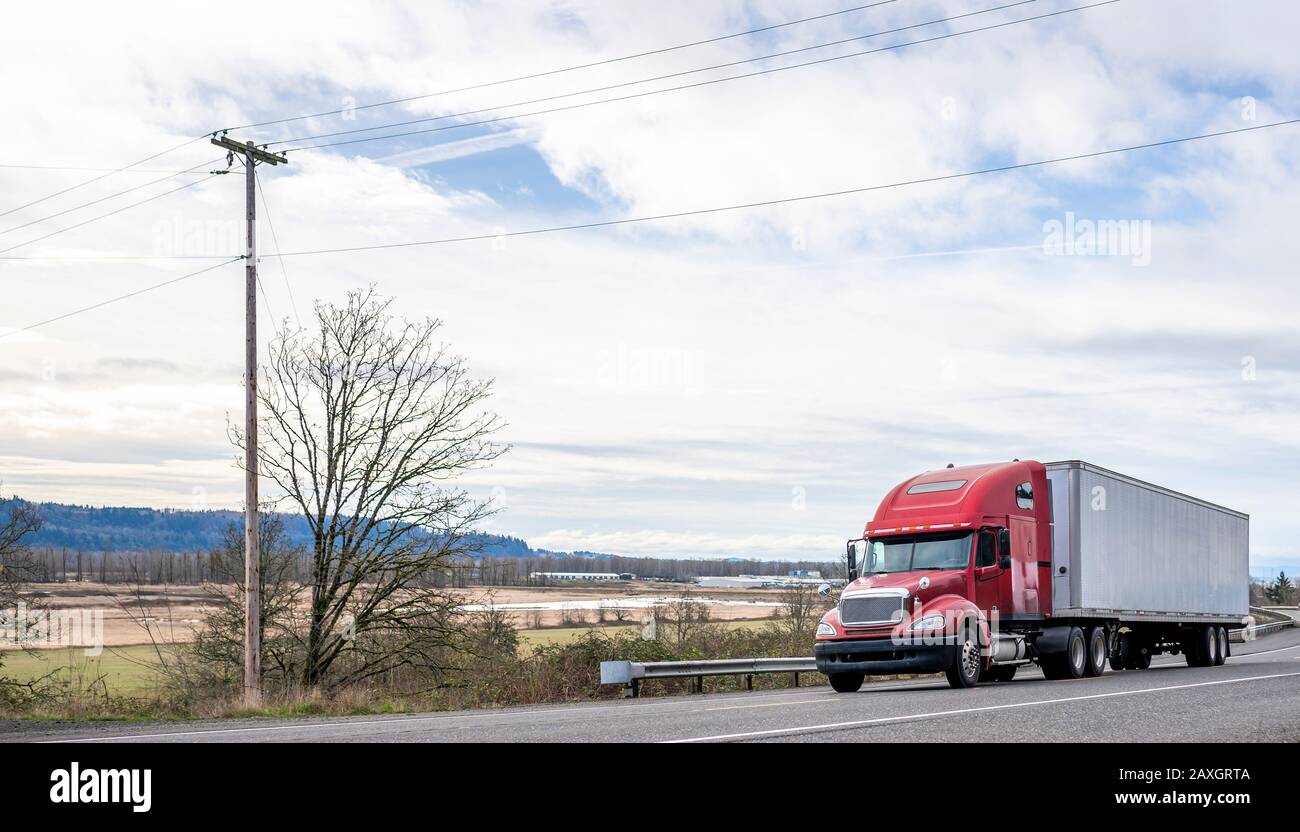 Big rig long haul red diesel semi truck with high cab configuration for ...