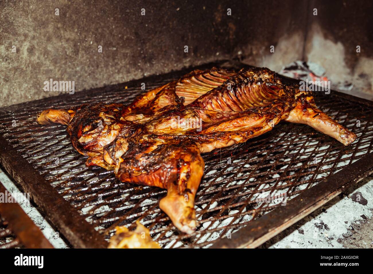 Traditional suckling pig cooked on the charcoal grill. The little pig ...