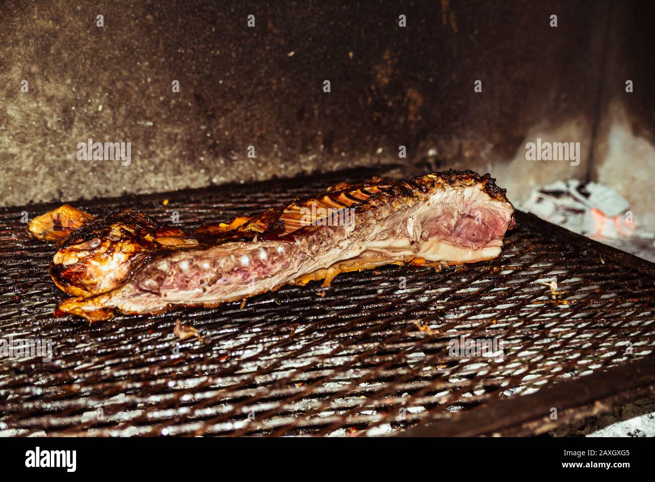 Traditional suckling pig cooked on the charcoal grill. The little pig ...