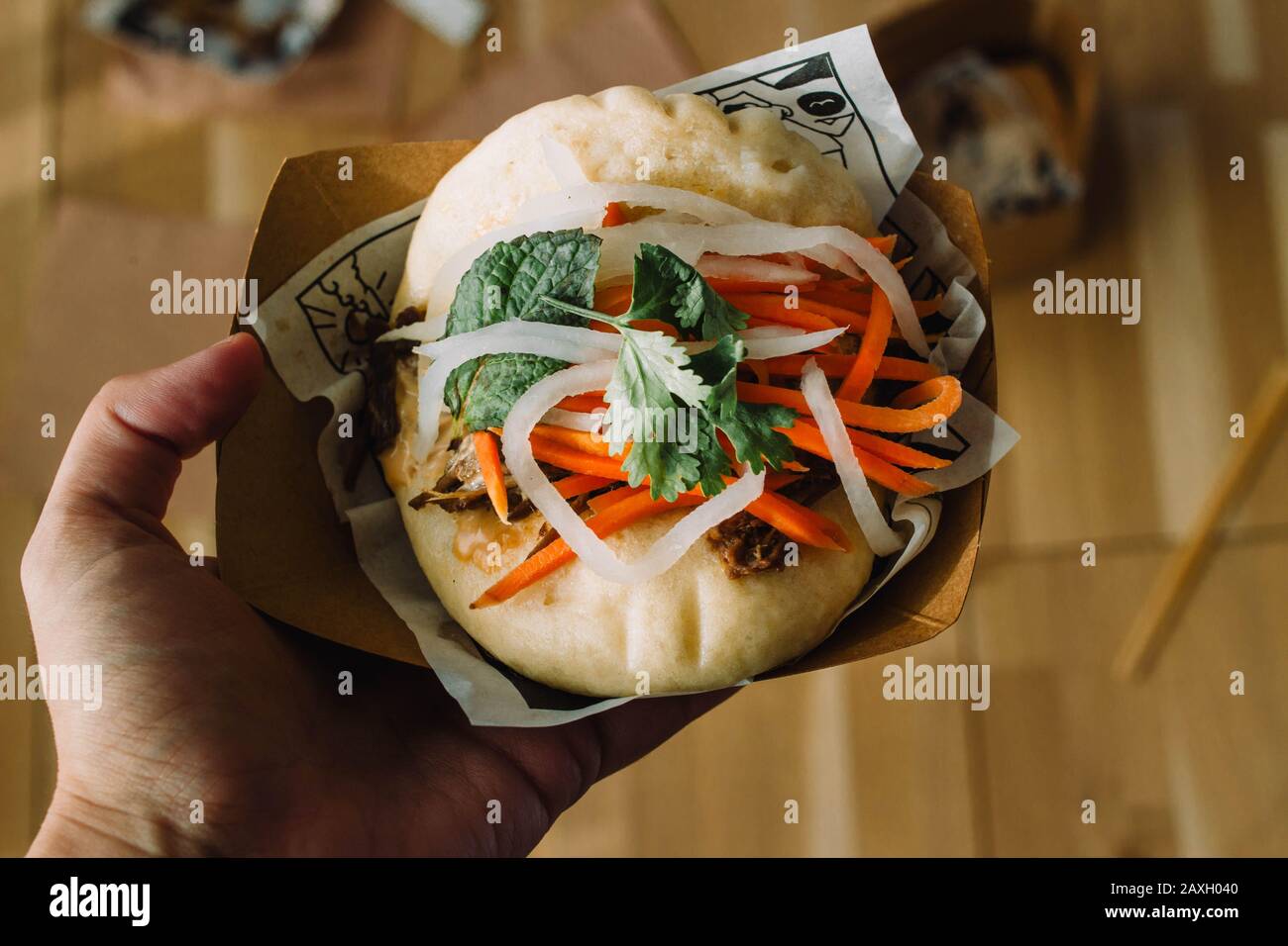 Hand holding gua bao, hirata buns, bao buns, guabao or baozi ...