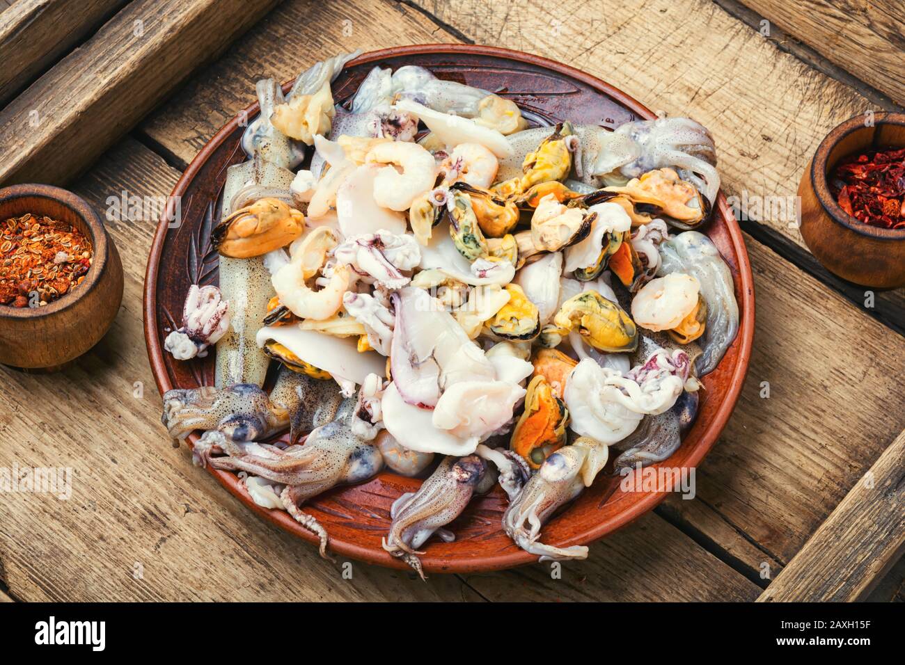 Raw fresh mussels,clams,squid, shrimps and spice.Different fresh ...