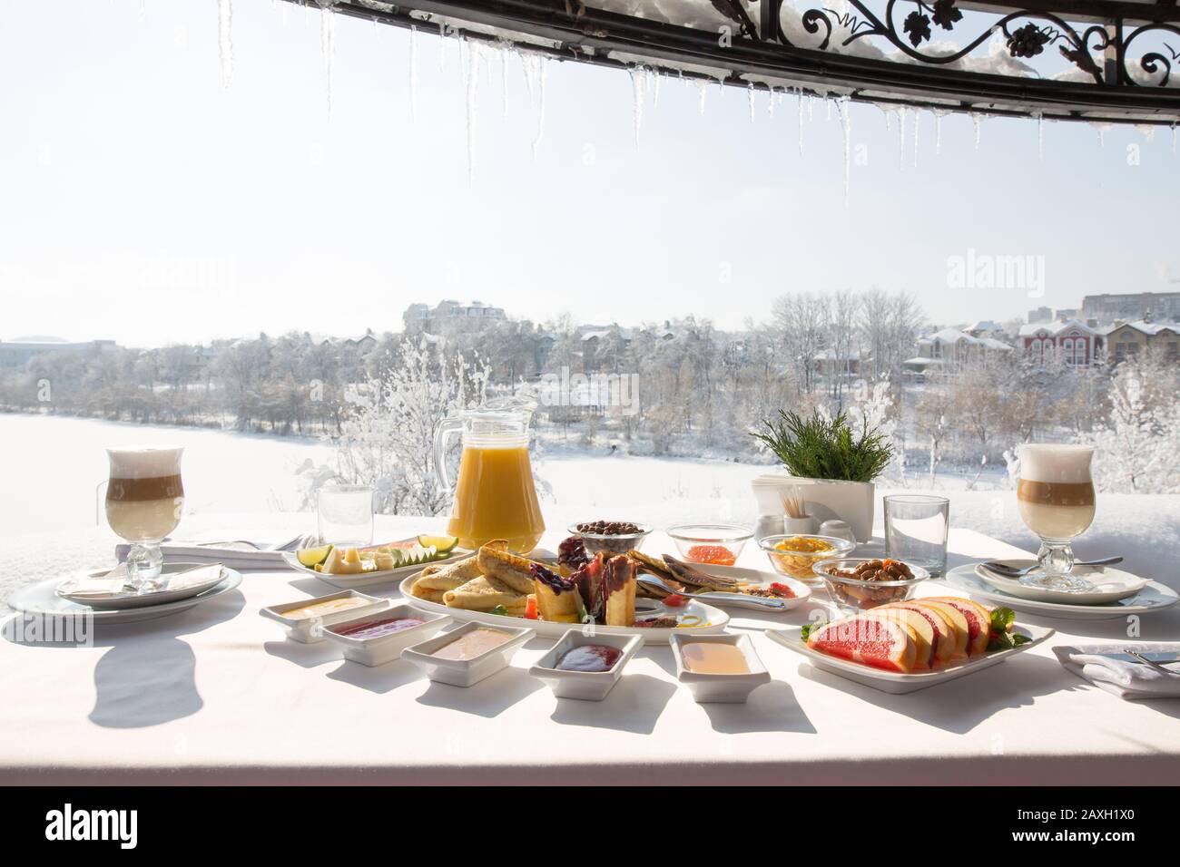 Breakfast at the restaurant in the snowy winter outdoors Stock Photo ...