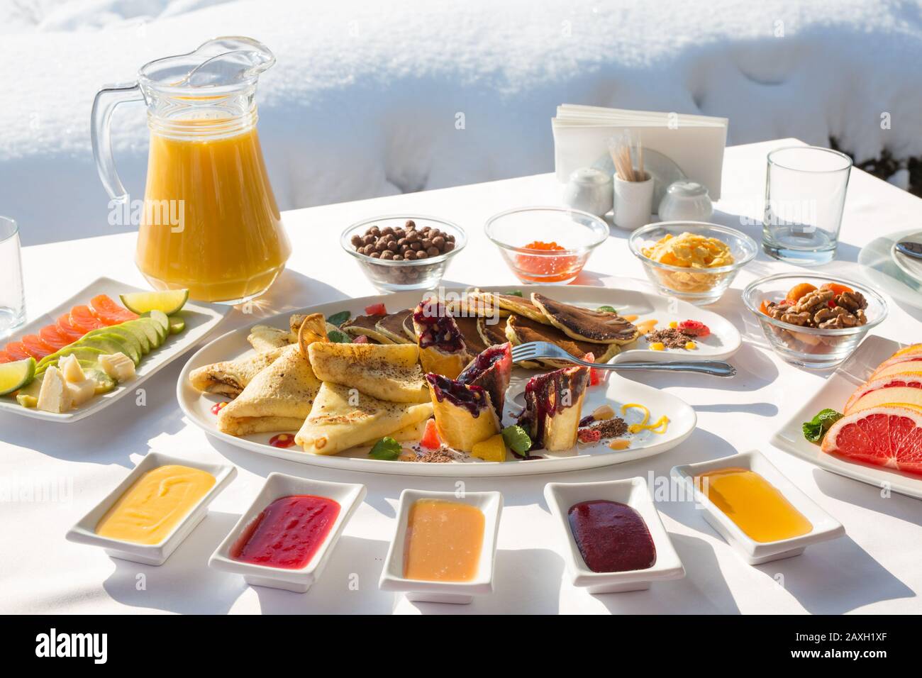 Breakfast at the restaurant in the snowy winter outdoors Stock Photo ...