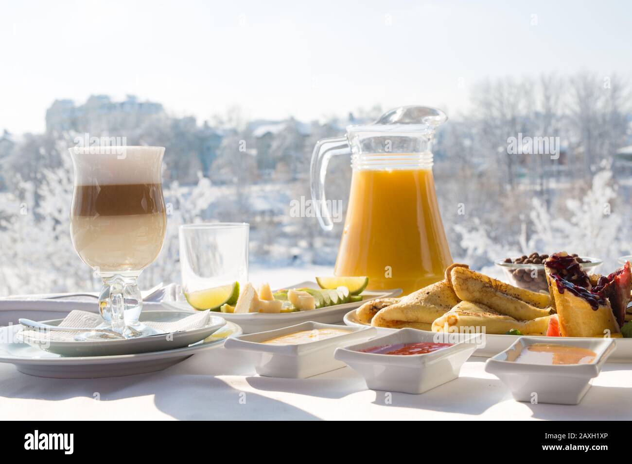 Breakfast at the restaurant in the snowy winter outdoors Stock Photo ...