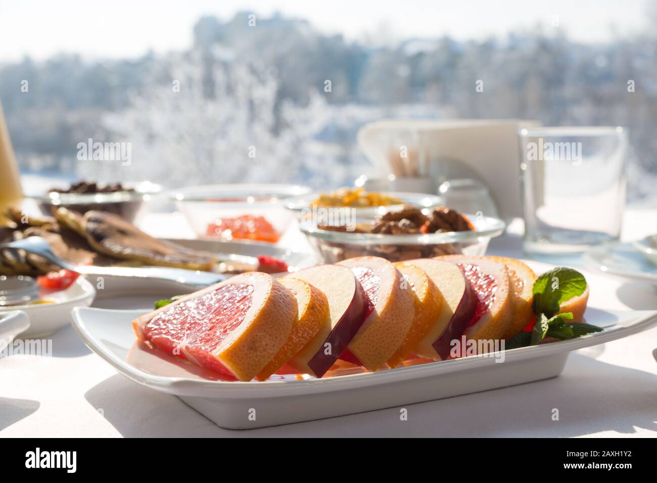 Breakfast at the restaurant in the snowy winter outdoors Stock Photo ...