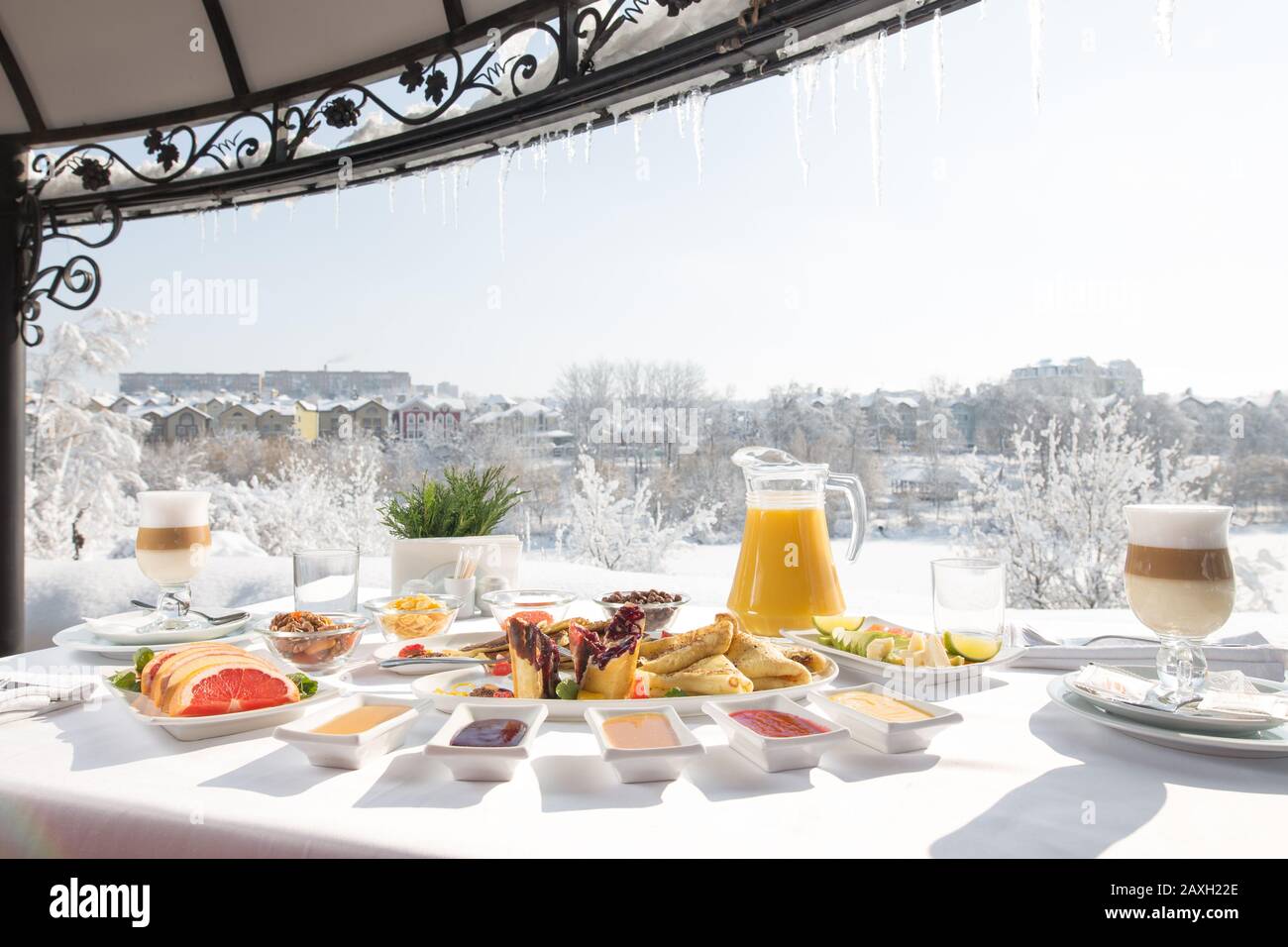 Breakfast at the restaurant in the snowy winter outdoors Stock Photo ...