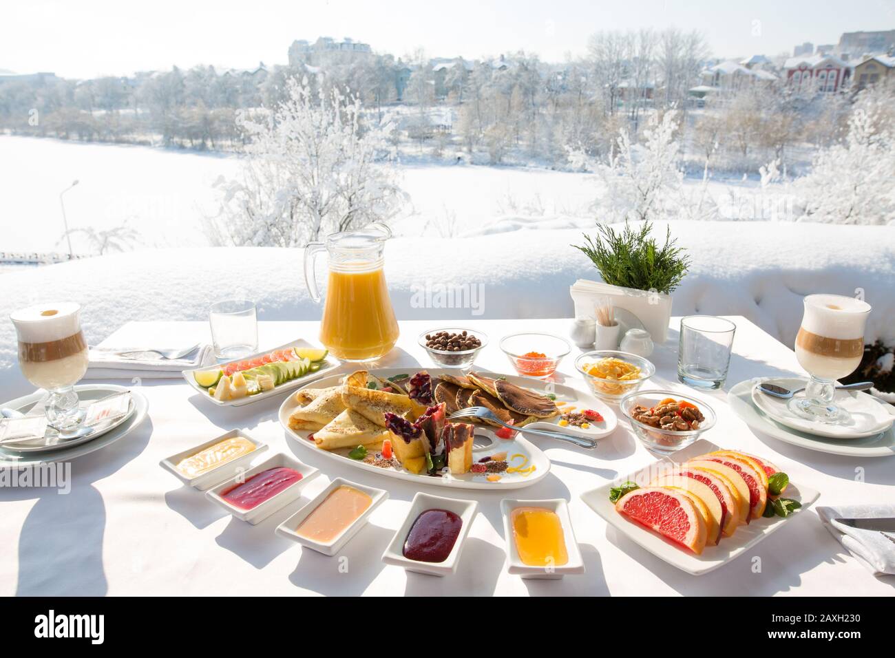 Breakfast at the restaurant in the snowy winter outdoors Stock Photo ...