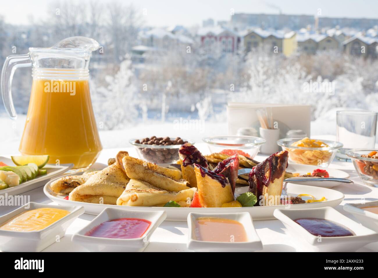 Breakfast at the restaurant in the snowy winter outdoors Stock Photo ...