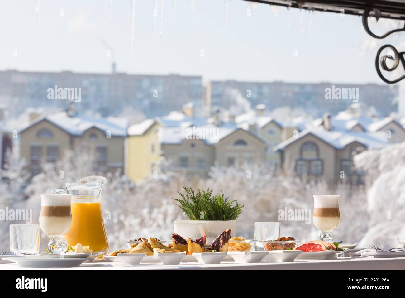 Breakfast at the restaurant in the snowy winter outdoors Stock Photo ...