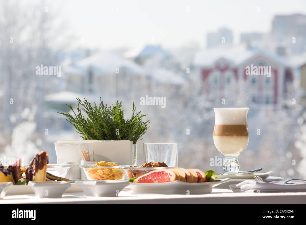 Breakfast at the restaurant in the snowy winter outdoors Stock Photo ...