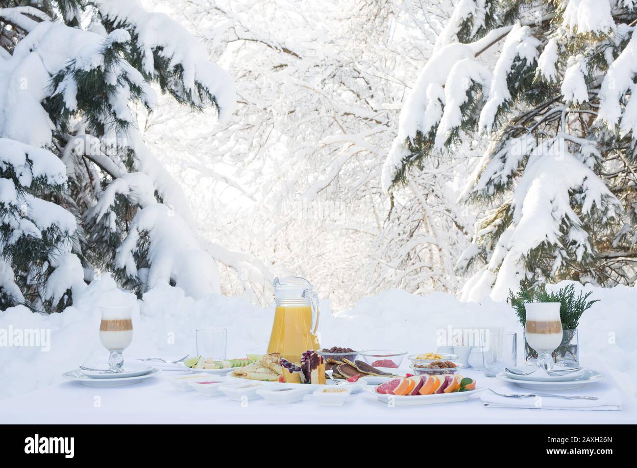 Breakfast at the restaurant in the snowy winter outdoors Stock Photo ...