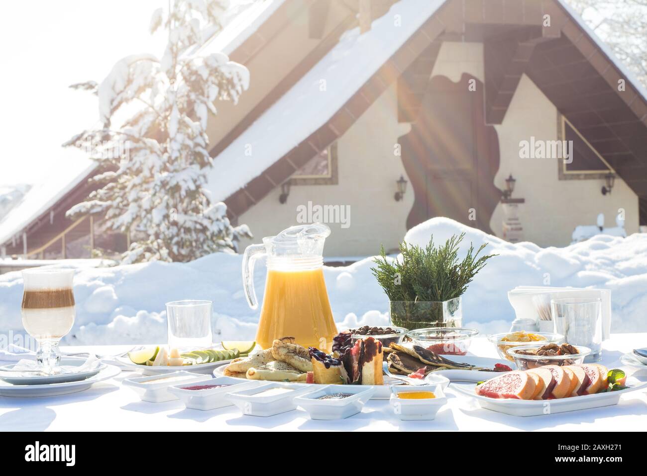 Breakfast at the restaurant in the snowy winter outdoors Stock Photo ...