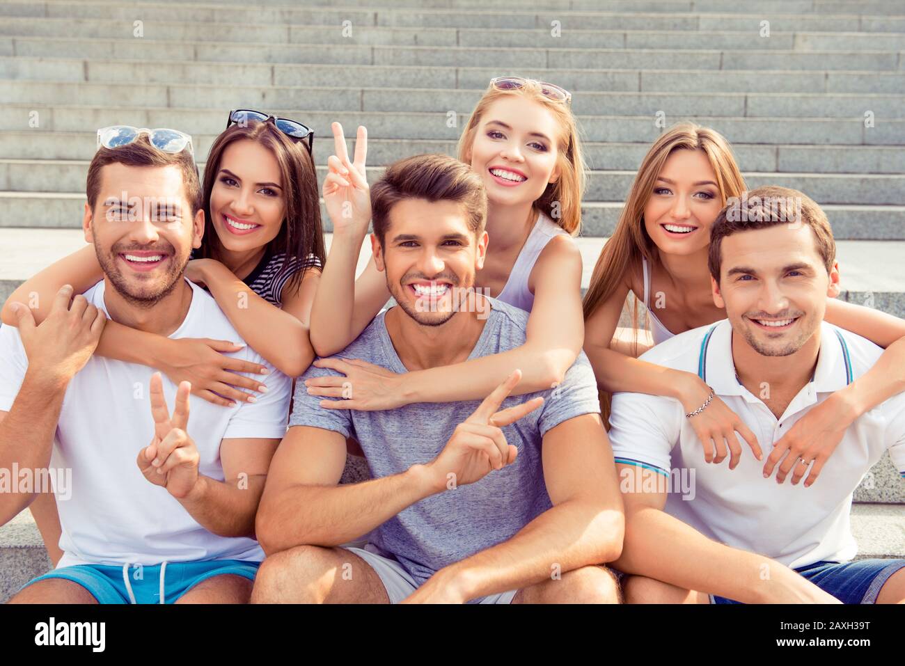 beautiful joyful bonding six friends hugging and having fun on vacation ...