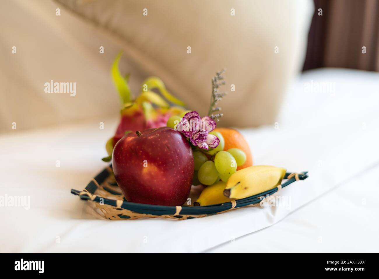 Healthy Fruit plate in bed in a hotel room Stock Photo - Alamy