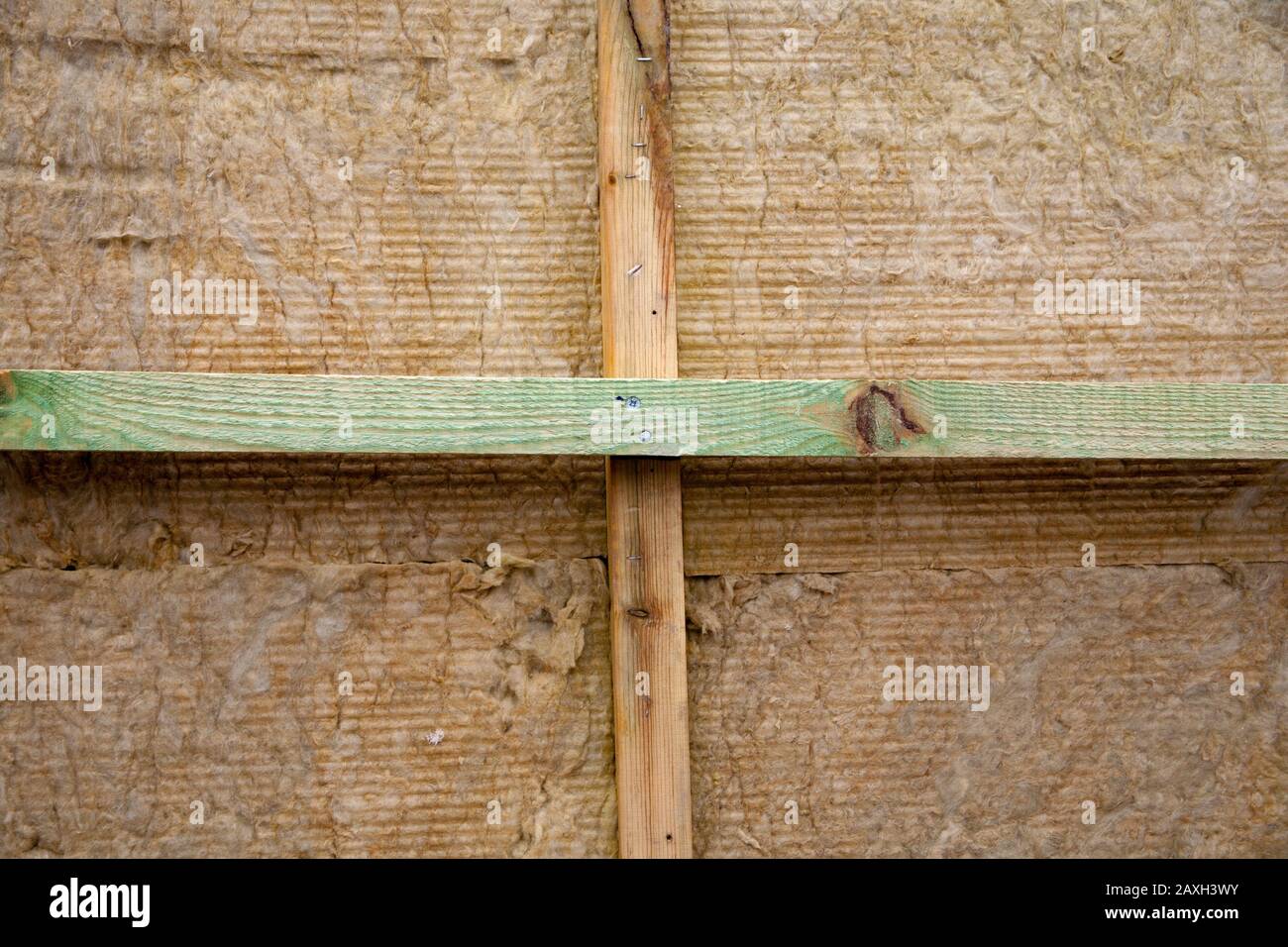 warming the walls of a stone house with a stone wool heater. Ecological ...