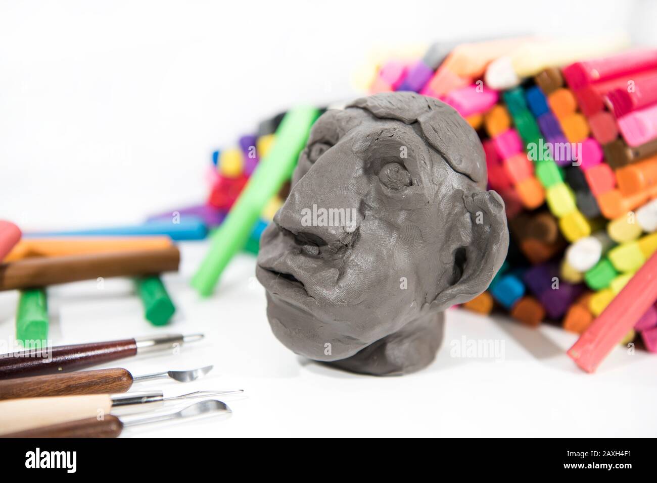 Child modelling with plasticine face hi-res stock photography and ...