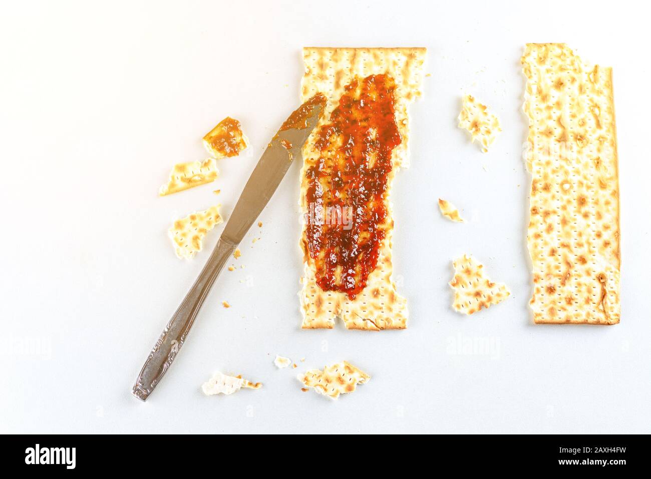 Jewish Passover holiday. Matzah and jam on white table. Pesach ...