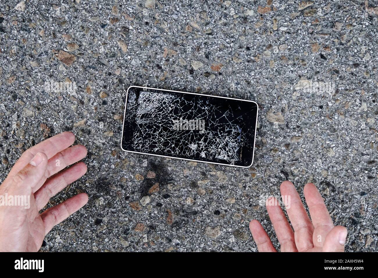 man dropped the phone from his hands on the asphalt and smashed the ...