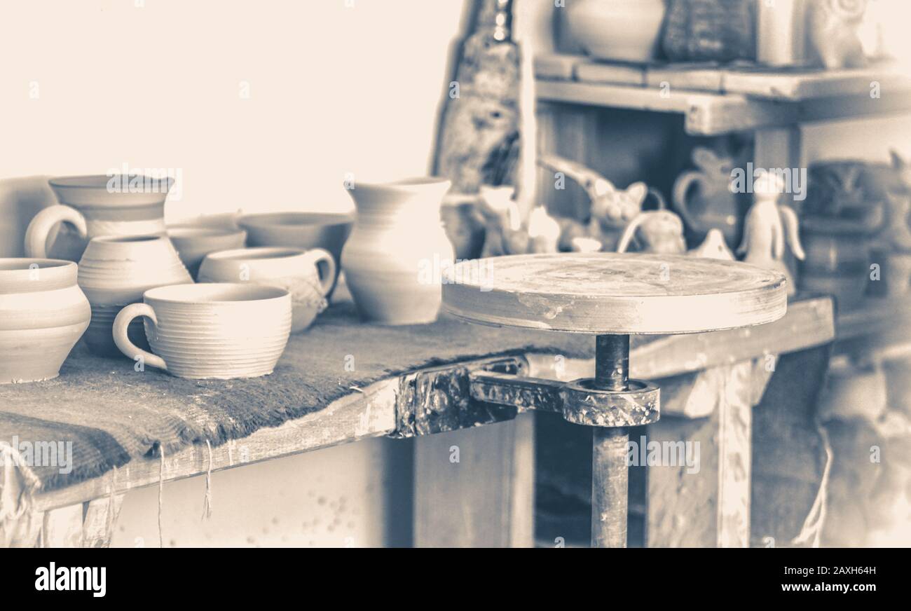 Old vintage photo. Interior pottery inside. Workplace of a potter ...