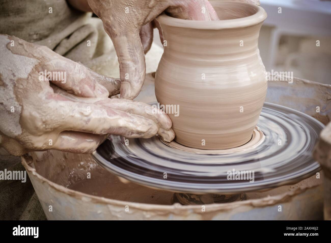 Master class on modeling of clay on a potter's wheel In the pottery ...