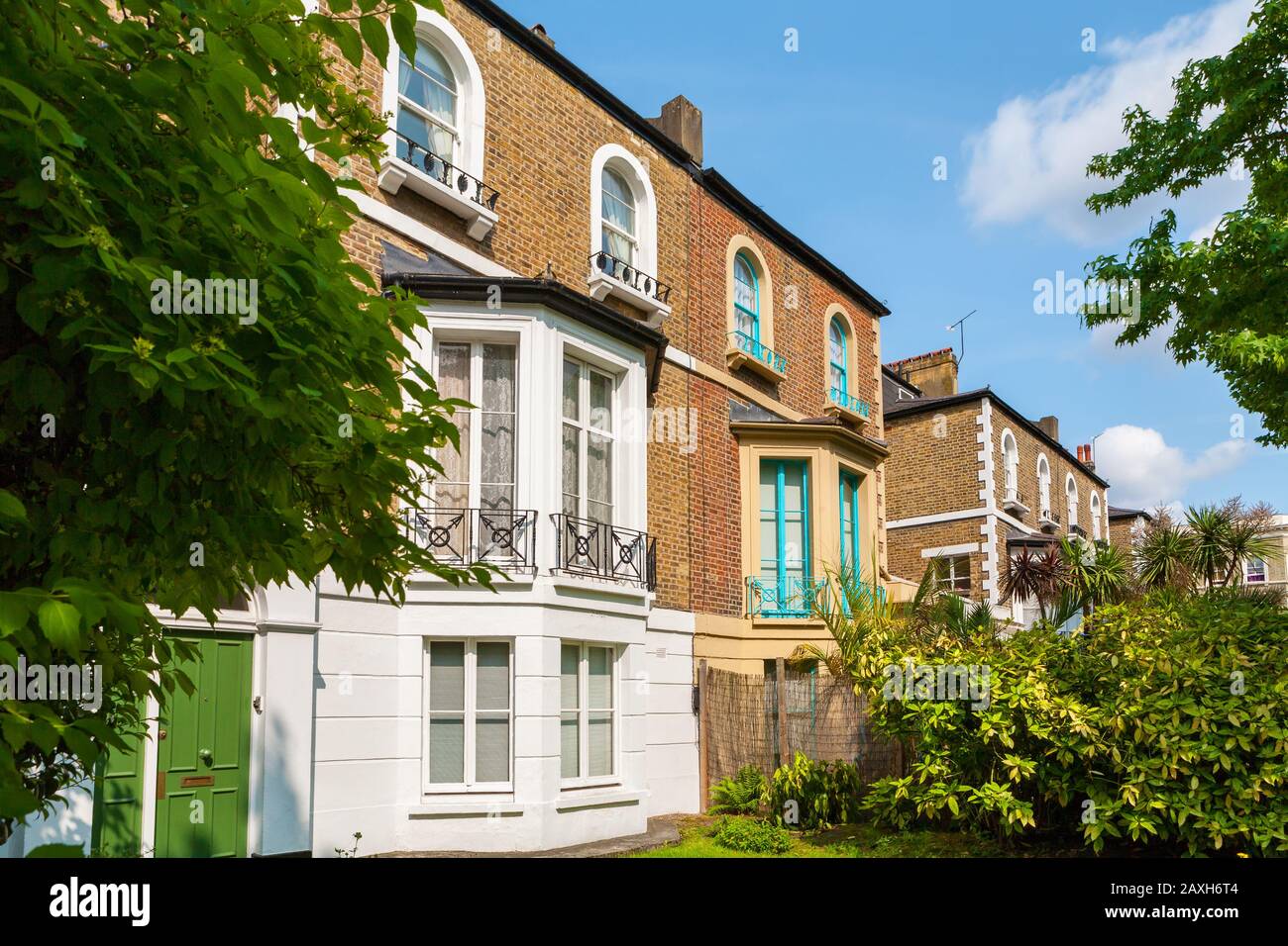 Street with traditional town houses at Hammersmith district in London ...
