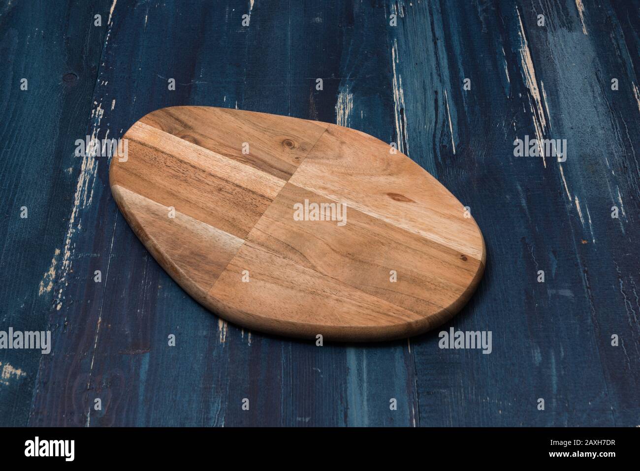 Round Plate on ocean blue wooden table background side view Stock Photo ...