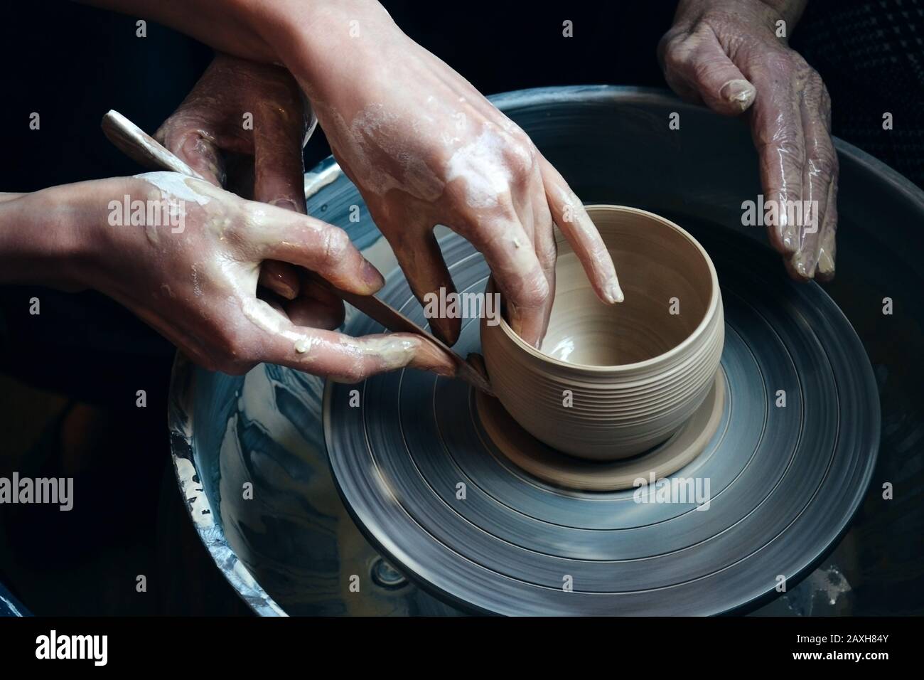 Master class on modeling of clay on a potter's wheel In the pottery ...