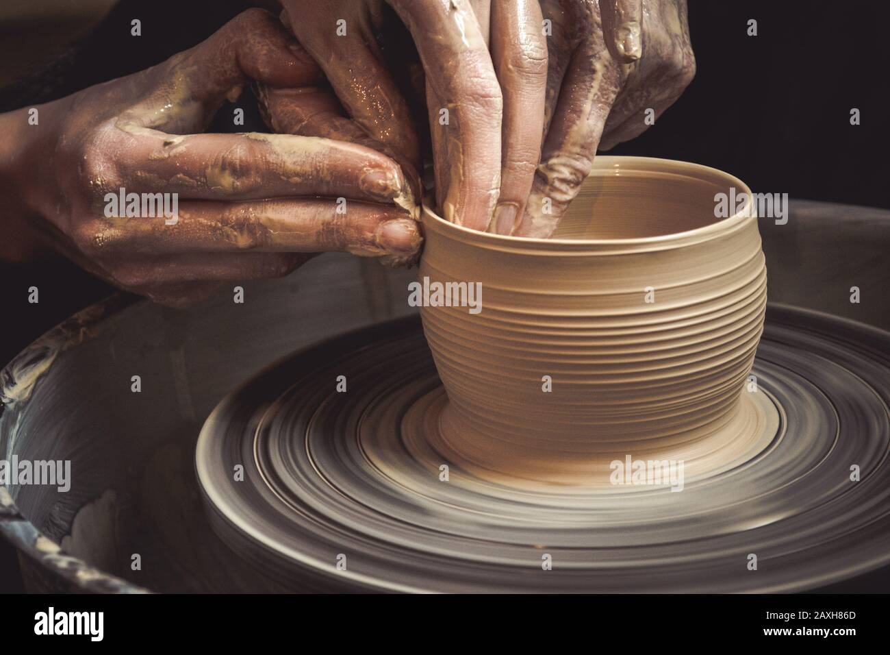 Master class on modeling of clay on a potter's wheel In the pottery ...