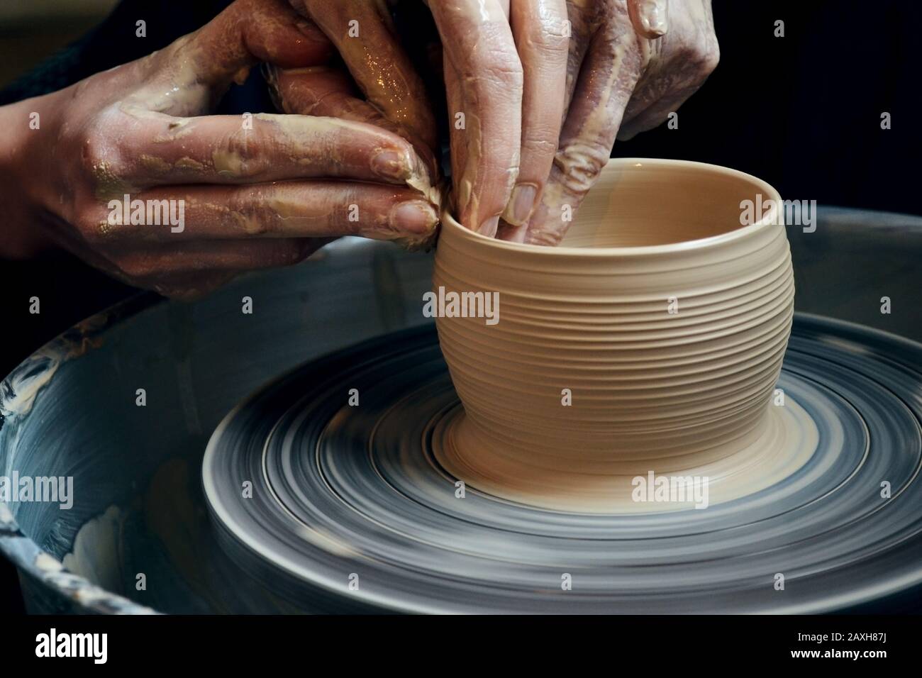 Master class on modeling of clay on a potter's wheel In the pottery ...