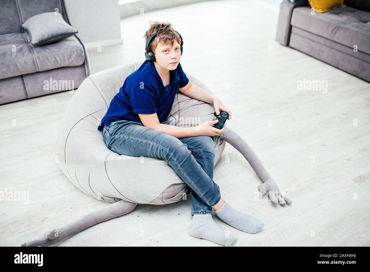 Gaming video games concept - teenage boy playing game with joystick and ...
