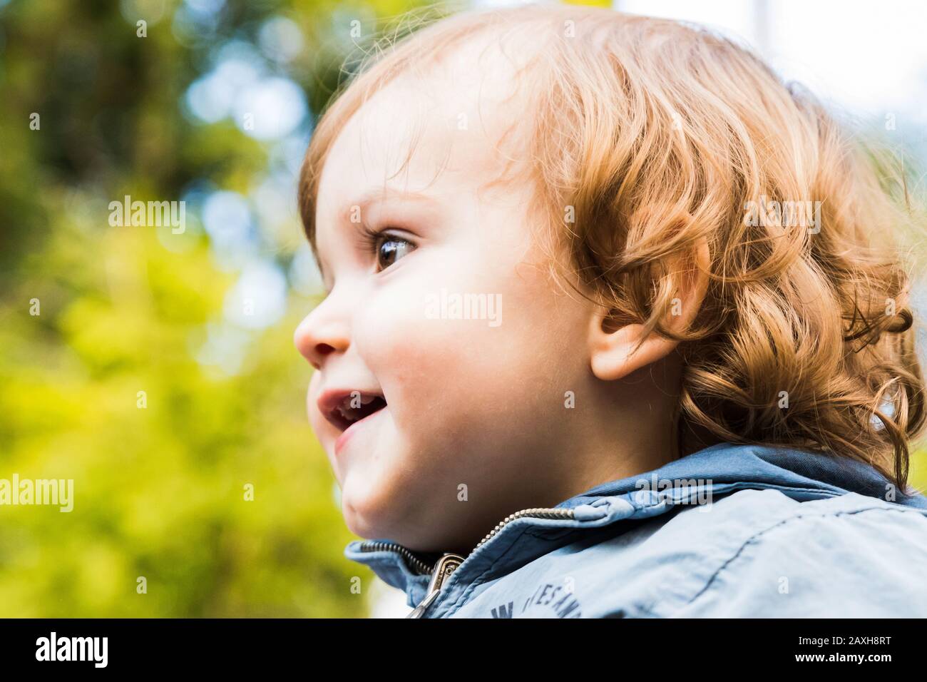 A baby playing on a forest path in autumn Stock Photo - Alamy