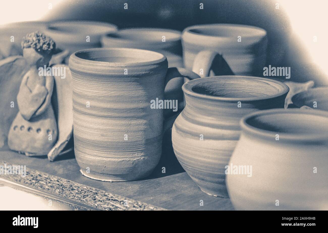Old vintage photo. Ceramic clay products stand on the shelf close-up ...