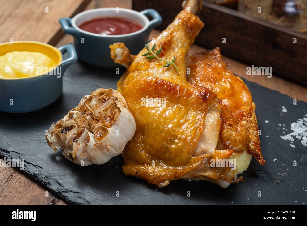 Grilled Chicken Thigh fine dining Dish Stock Photo - Alamy