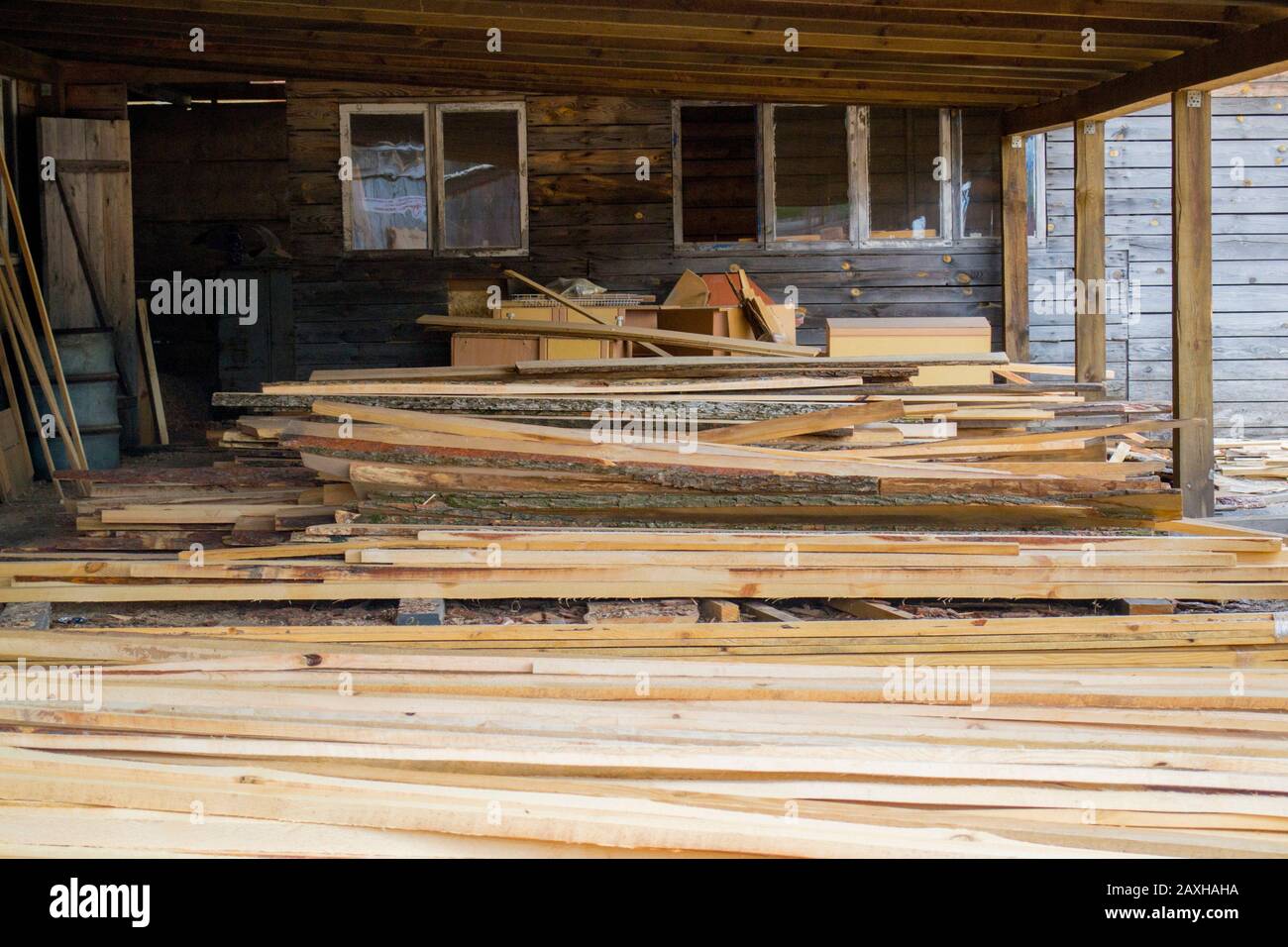 Sawmill. Warehouse for sawing boards on a sawmill outdoors. Wood timber ...