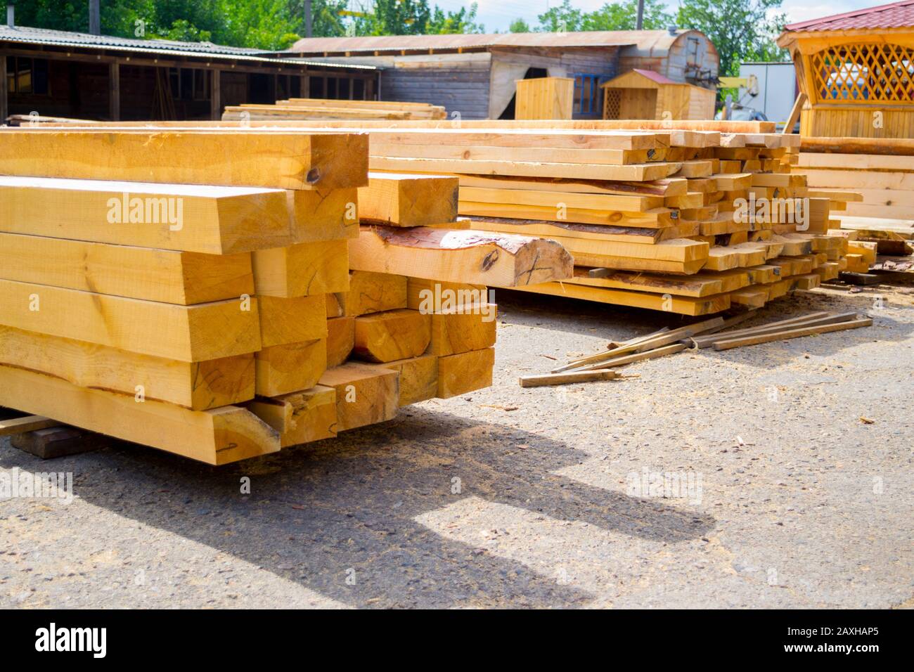 Sawmill. Warehouse for sawing boards on a sawmill outdoors. Wood timber ...