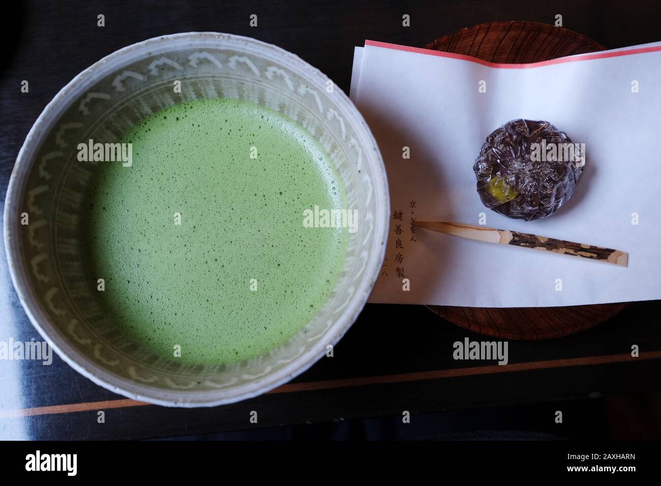 Matcha green tea and Japanese traditional sweet or wagashi are pictured ...