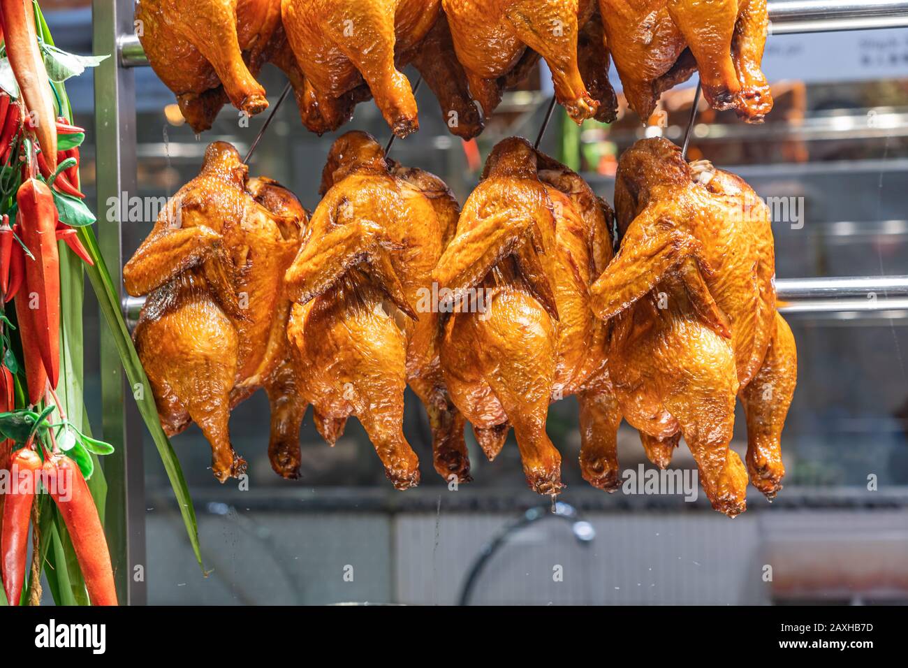 Whole roasted chickens hang in rows at Chinese restaurant's showcase ...