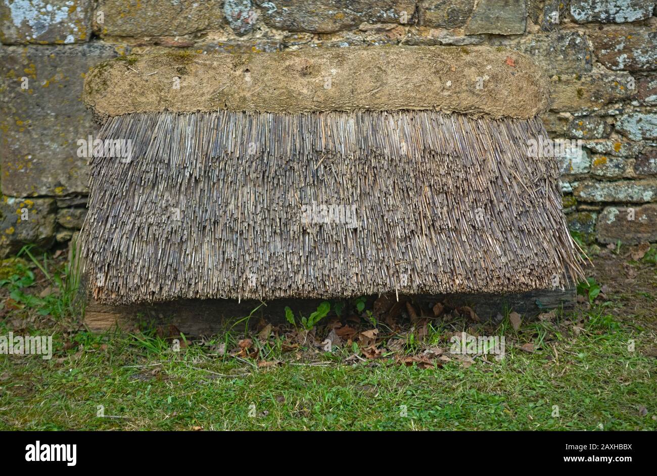 Old style cane canopy next to an stone wall Stock Photo - Alamy