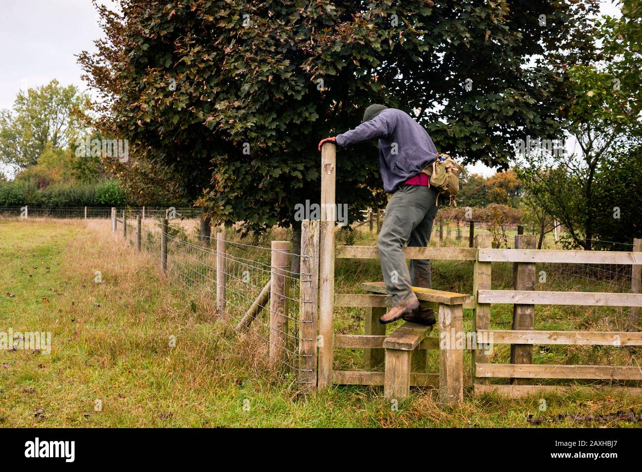 Wooden step-over stile on the Public Footpath in England outside Bibury ...