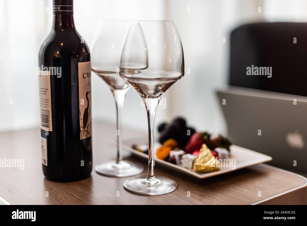 Hotel Wine Bottle and glass Set up with canapé Stock Photo - Alamy